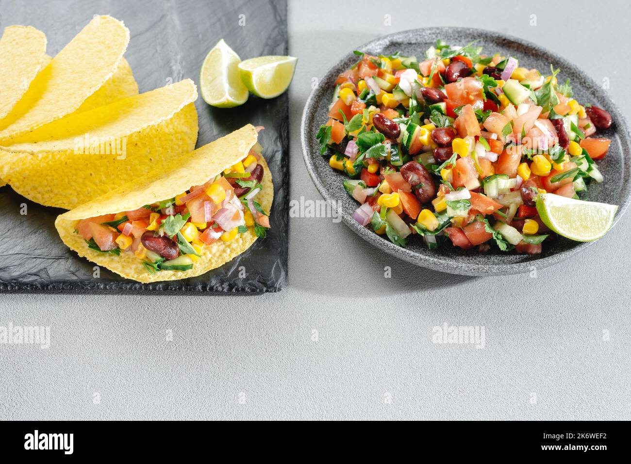Salsa with corn and beans on a wooden backdrop with tacos. Mexican ...
