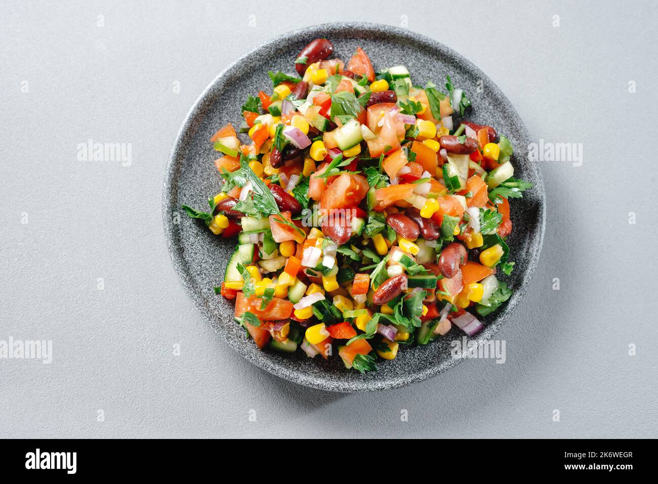 Texas salad or Texas caviar. Veggie dish with corn beans and peppers on ...
