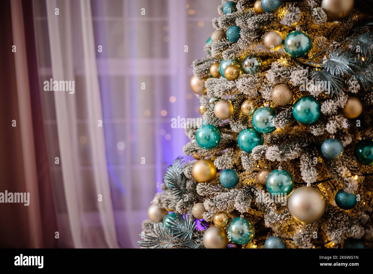 Christmas decorations on the tree, beautiful toys in light colors ...