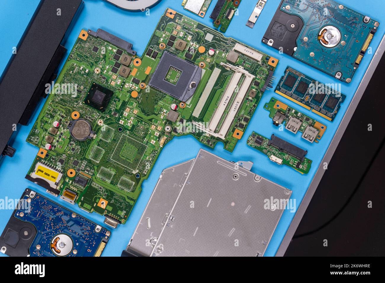 Parts of a modern computer. The insides of a laptop on a blue ...