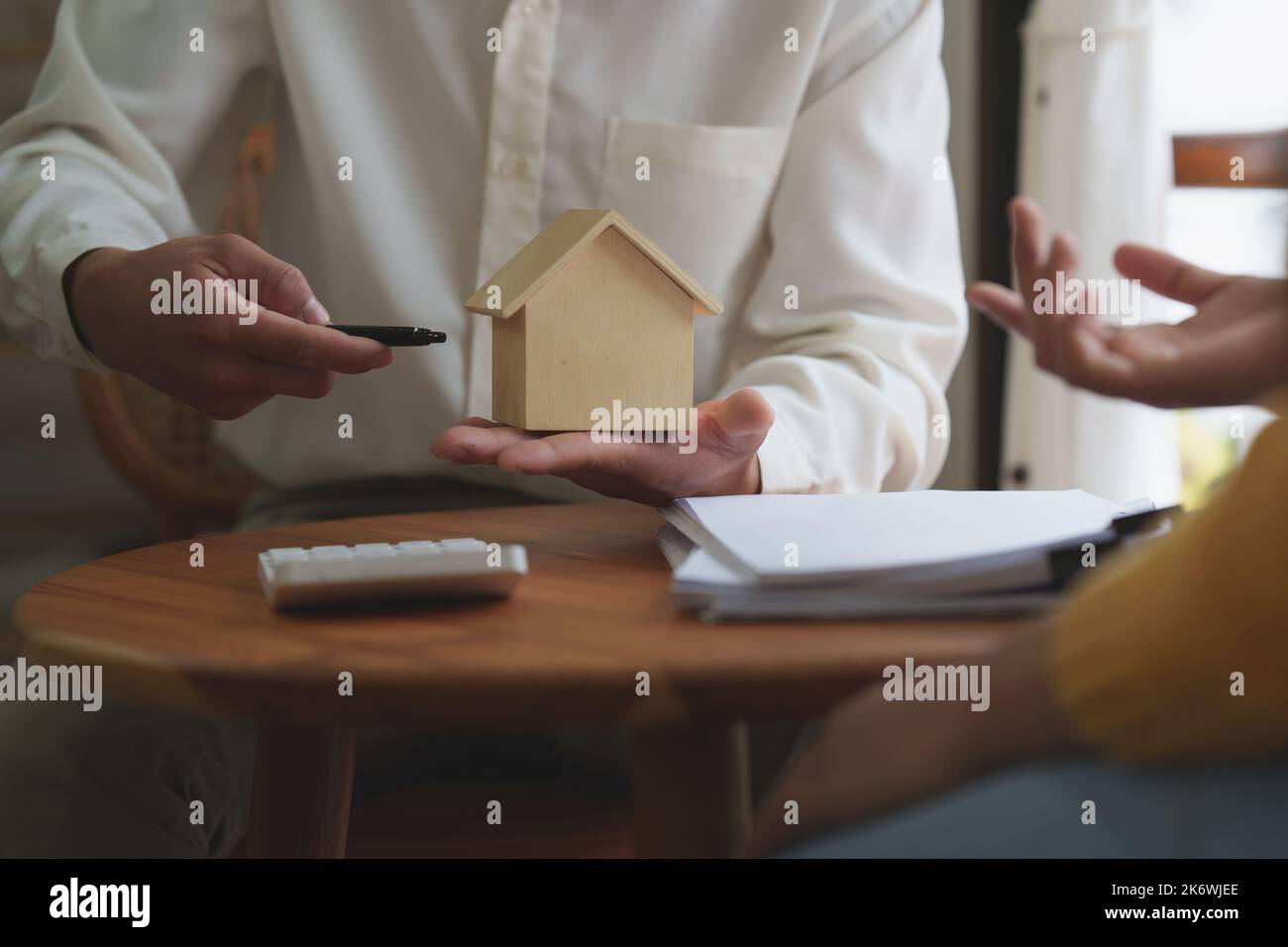 Real Estate Agent explain insurance and agreement contract to client ...