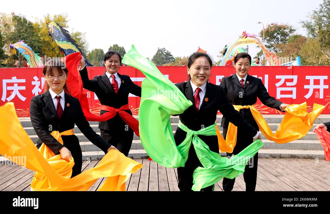 ZAOZHUANG, CHINA - OCTOBER 16, 2022 - People dance streamers at a park ...