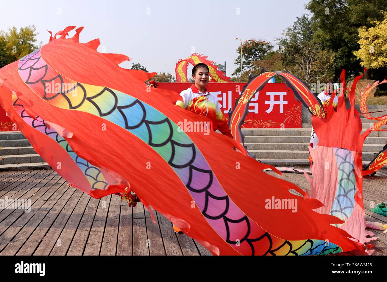 ZAOZHUANG, CHINA - OCTOBER 16, 2022 - People dance streamers at a park ...