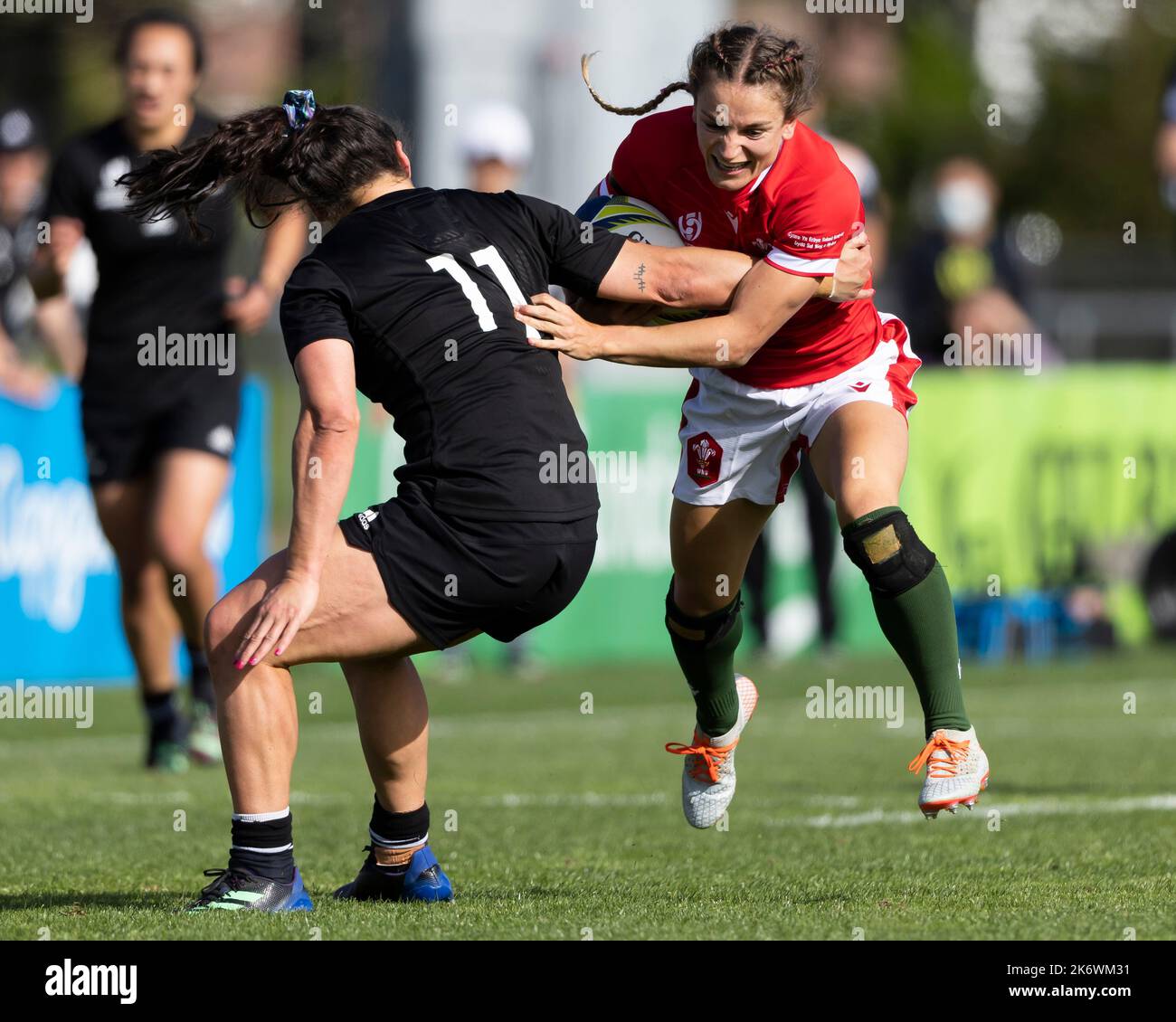 Wales' Jasmine Joyce is tackled by New Zealand's Portia Woodman during ...