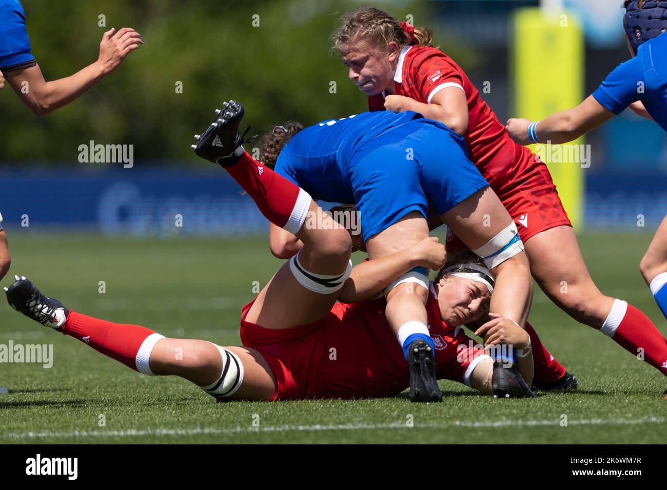 Italy's Valeria Fedrighi is tackled by Canada's Courtney Holtkamp ...