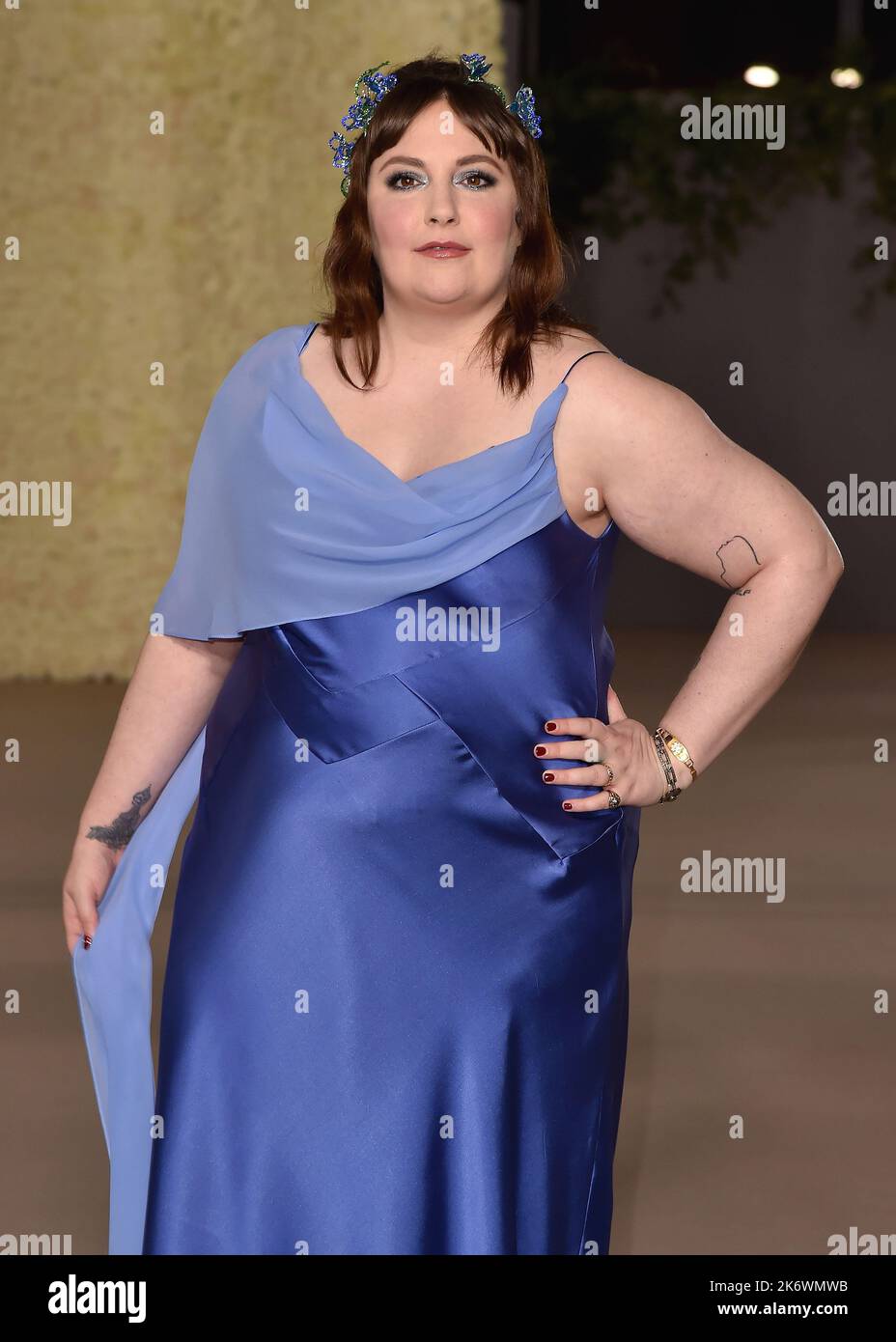Lena Dunham walking the red carpet at the Second Annual Academy Museum ...