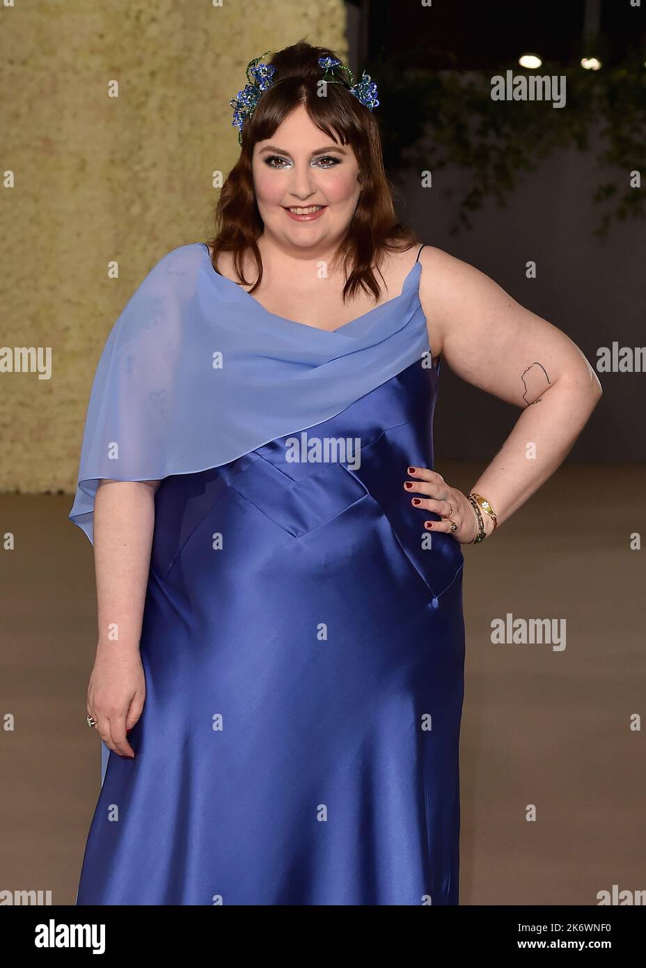Lena Dunham walking the red carpet at the Second Annual Academy Museum ...