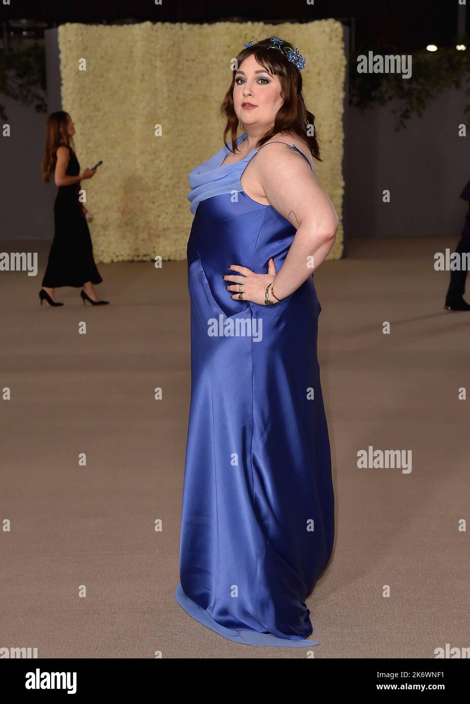 Lena Dunham walking the red carpet at the Second Annual Academy Museum ...
