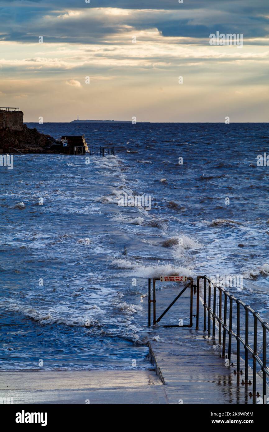 High tide over topping the sea wall Stock Photo - Alamy