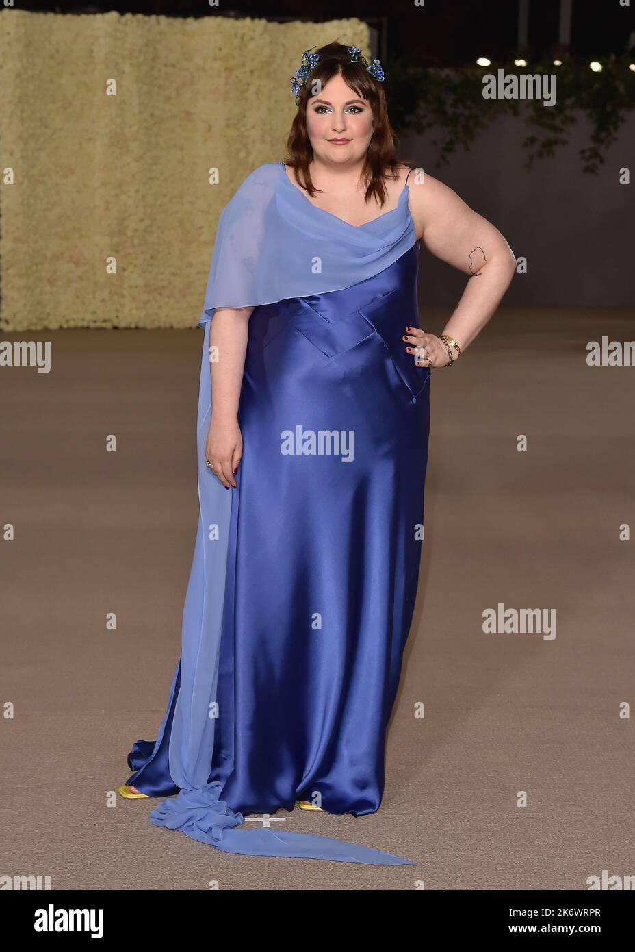 Lena Dunham walking the red carpet at the Second Annual Academy Museum ...