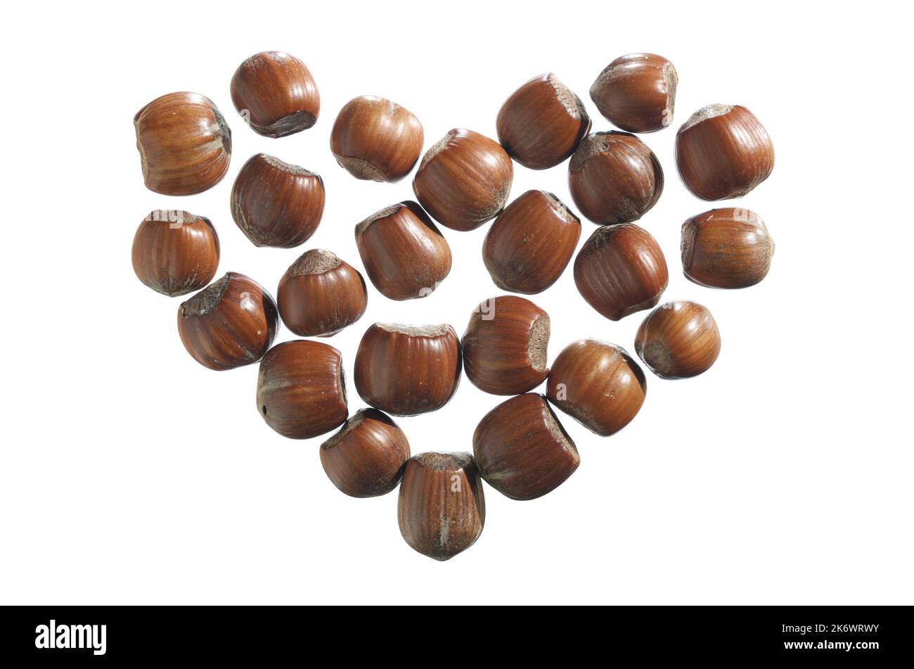 Hazelnuts in shape of heart isolated on a white background, top view ...