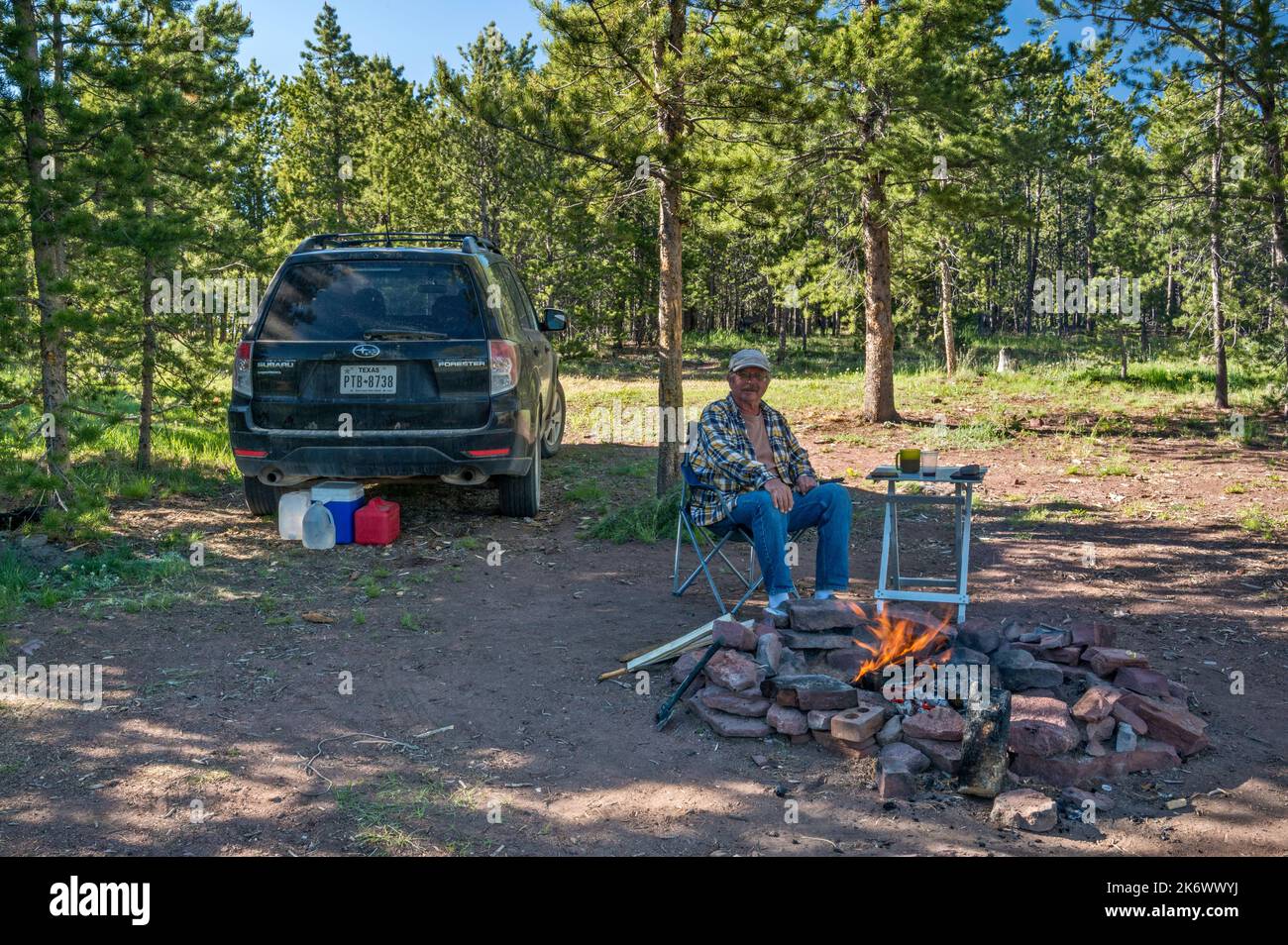 Camper at fire ring, campsite near Ute Mountain Trailhead and Browne ...