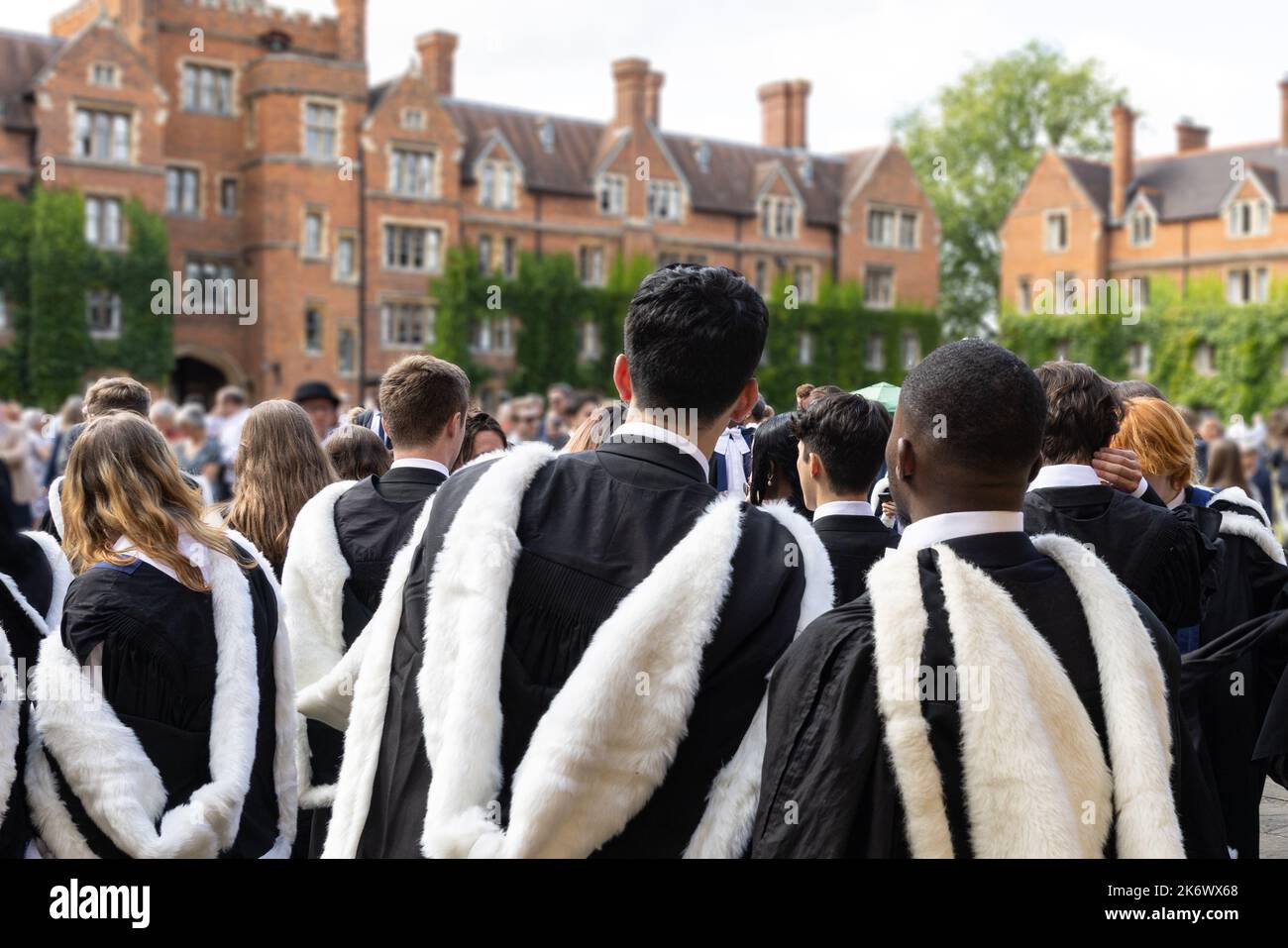 29 6 2022 back view of Male and female fresh graduate students with ...