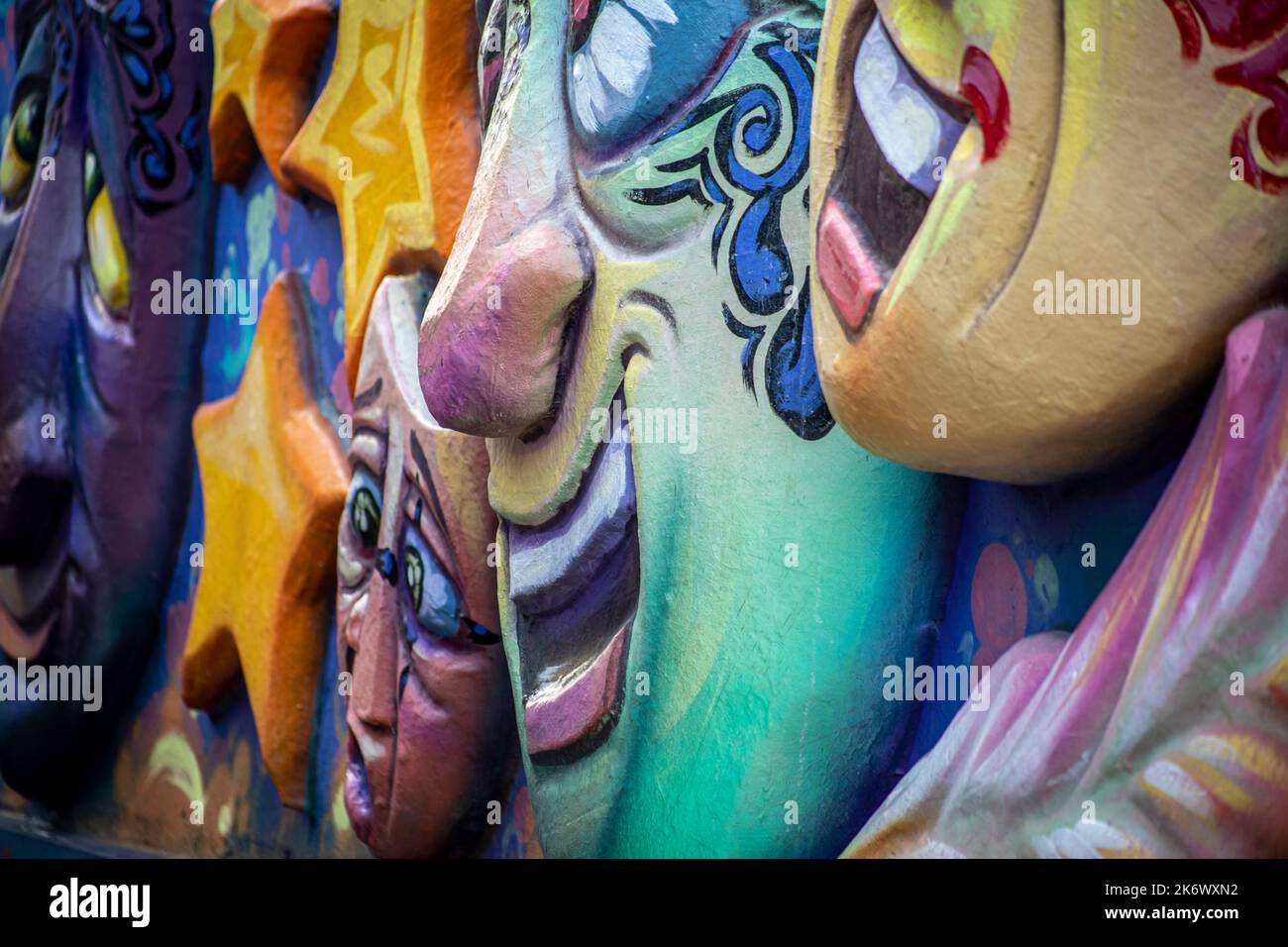 Cheerful and colorful masks decorating a float in a carnival parade ...