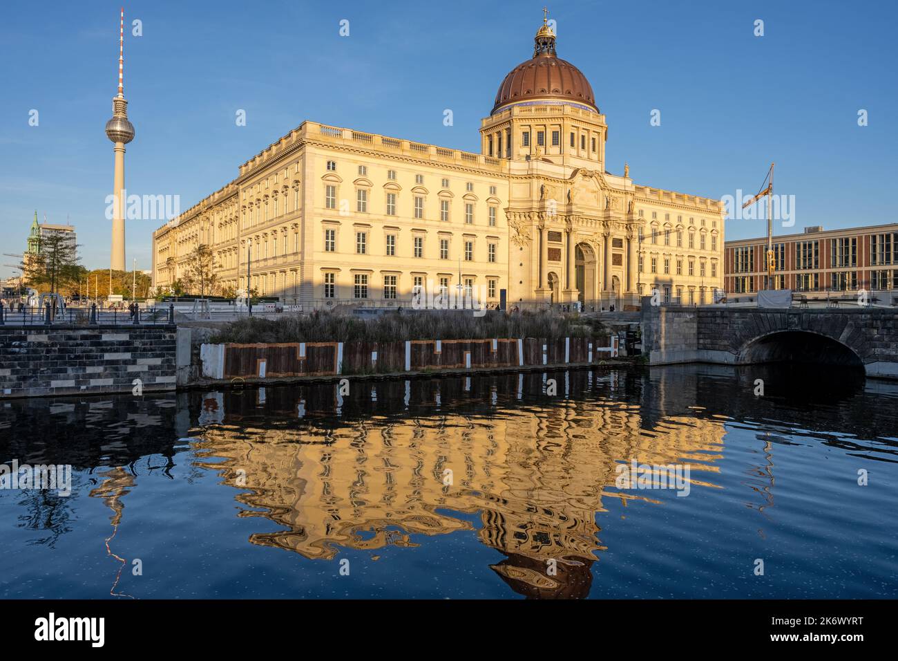 The rebuilt Berlin City Palace with a reflection in a small canal and ...
