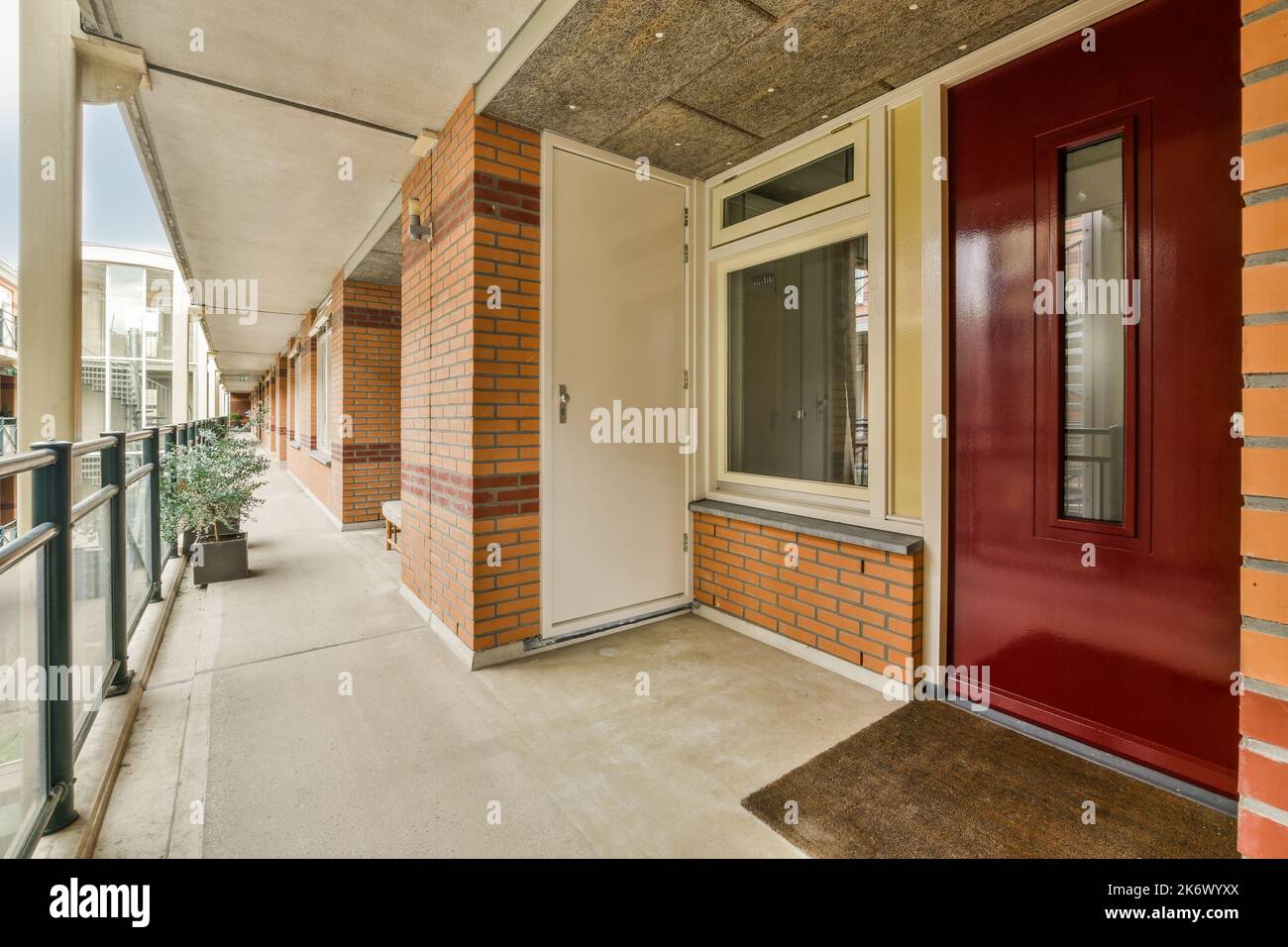 Front view of brick buildings from small balcony with railings Stock ...