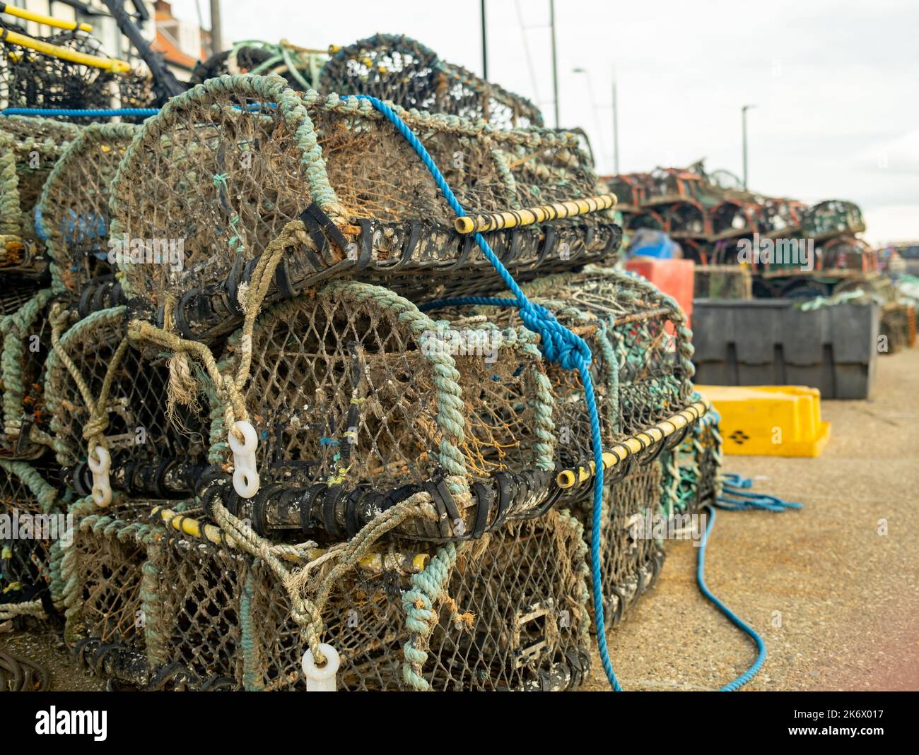 Crab pots, lobster pots and fish traps on the quaside in the seasidde ...