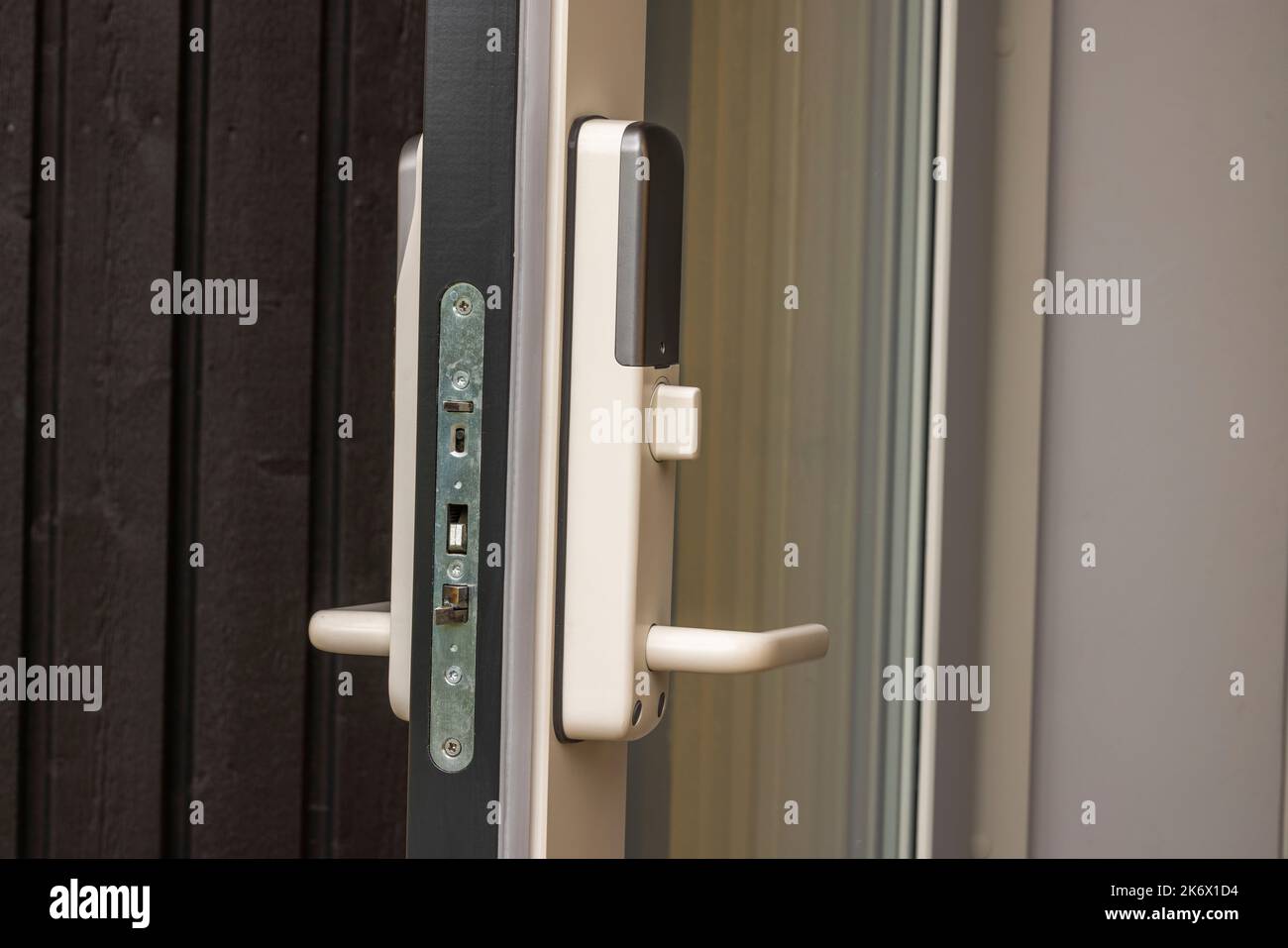 View of open front door of villa with white digital lock. Sweden Stock ...