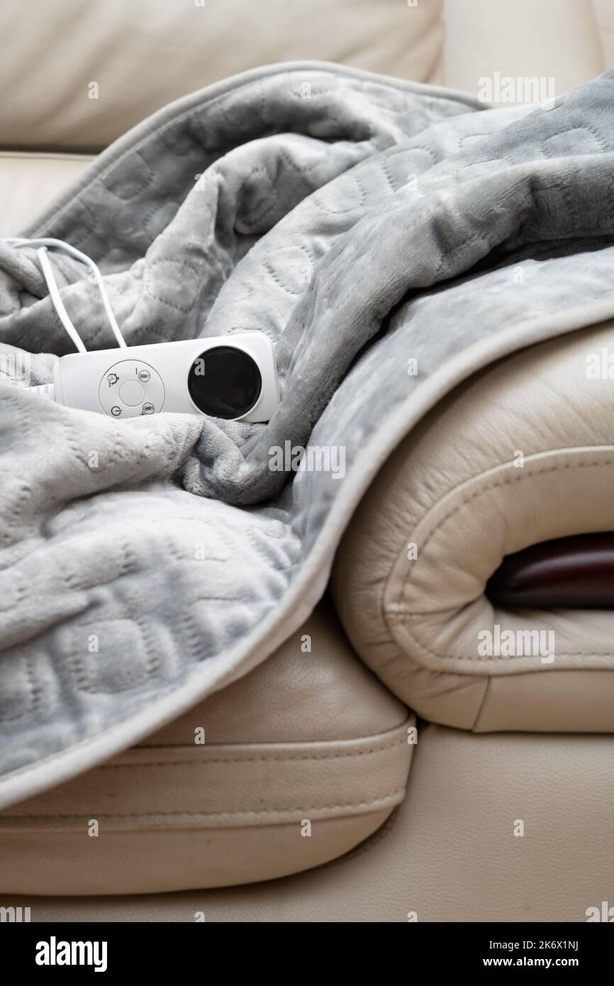 electric blanket with controller on a sofa vertical composition Stock ...