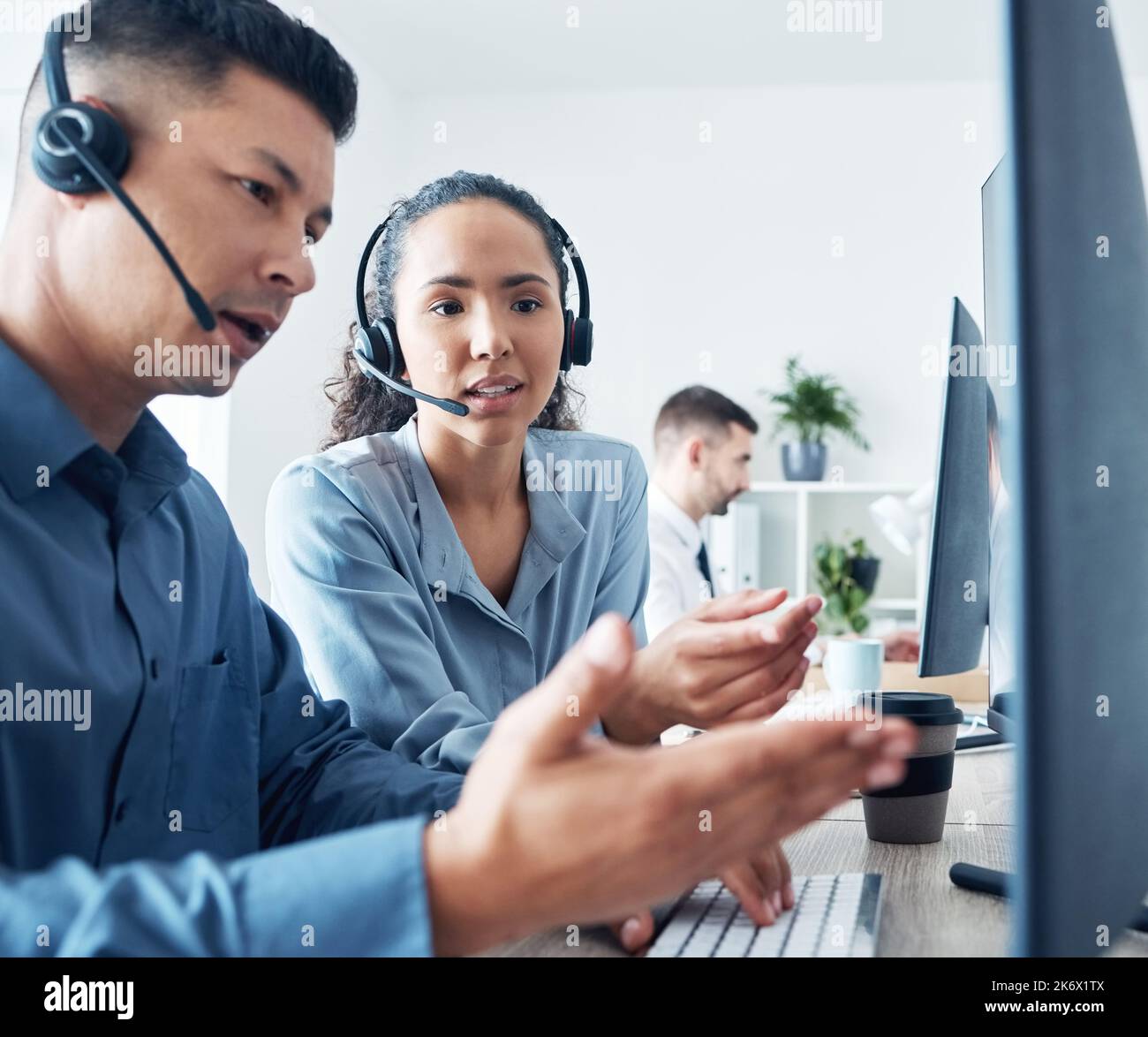 Call centre agents talking business hi-res stock photography and images ...