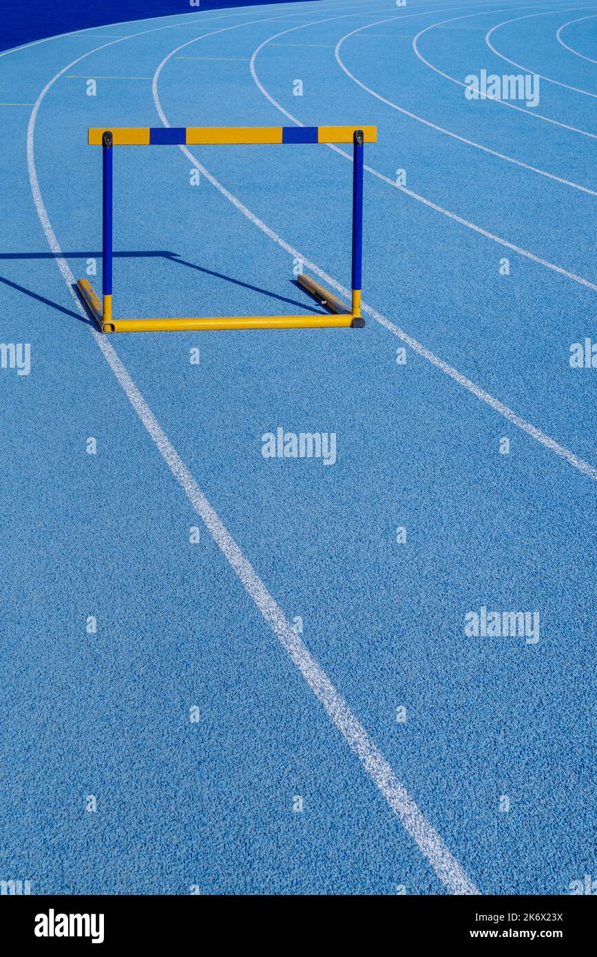 Hurdles on running track in stadium Stock Photo - Alamy