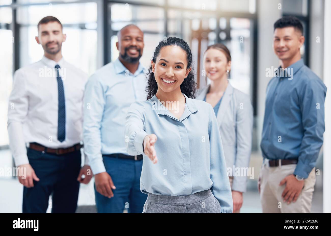 Lets work together. a young businessman extending her hand out for a ...