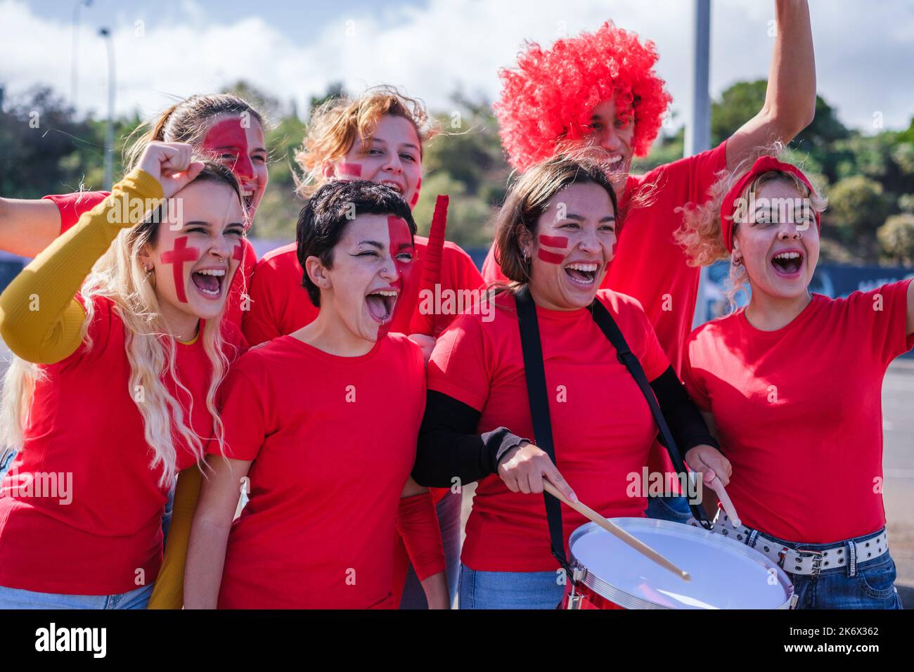 Group of fans defending and cheering on their team at the world ...
