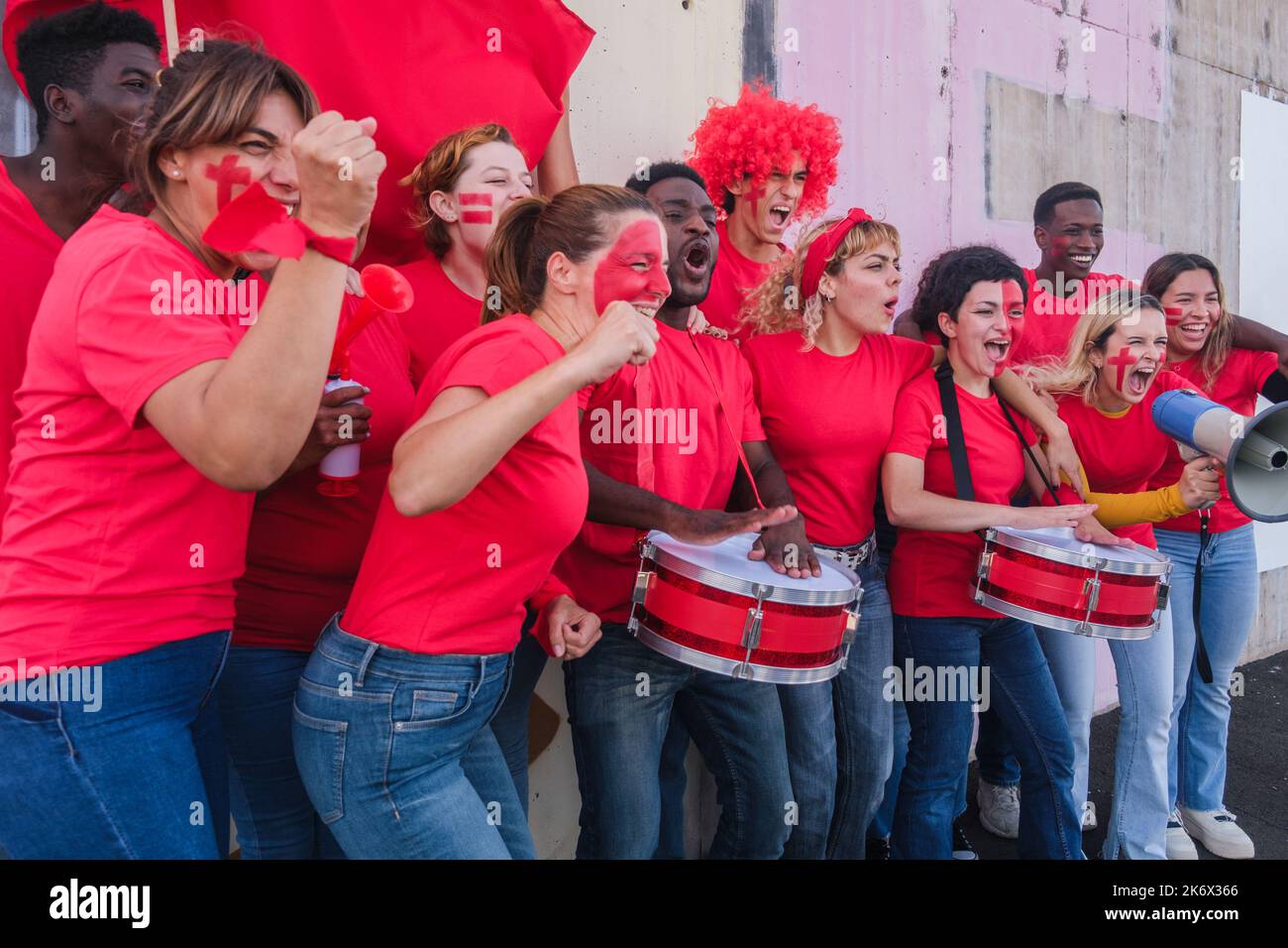Large group of fans from different backgrounds and classes together ...