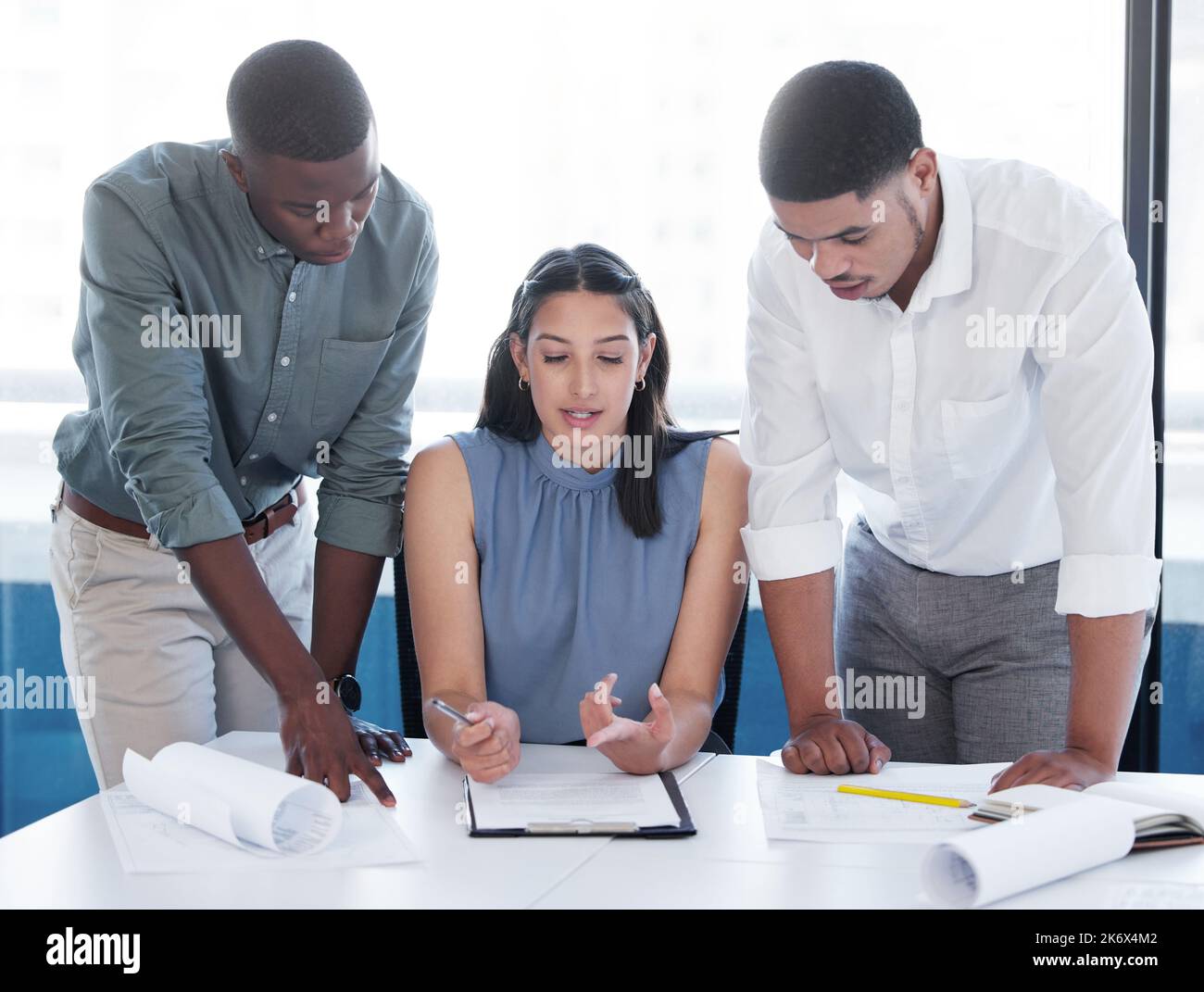 Together we can achieve anything. a team of young architects drawing up ...