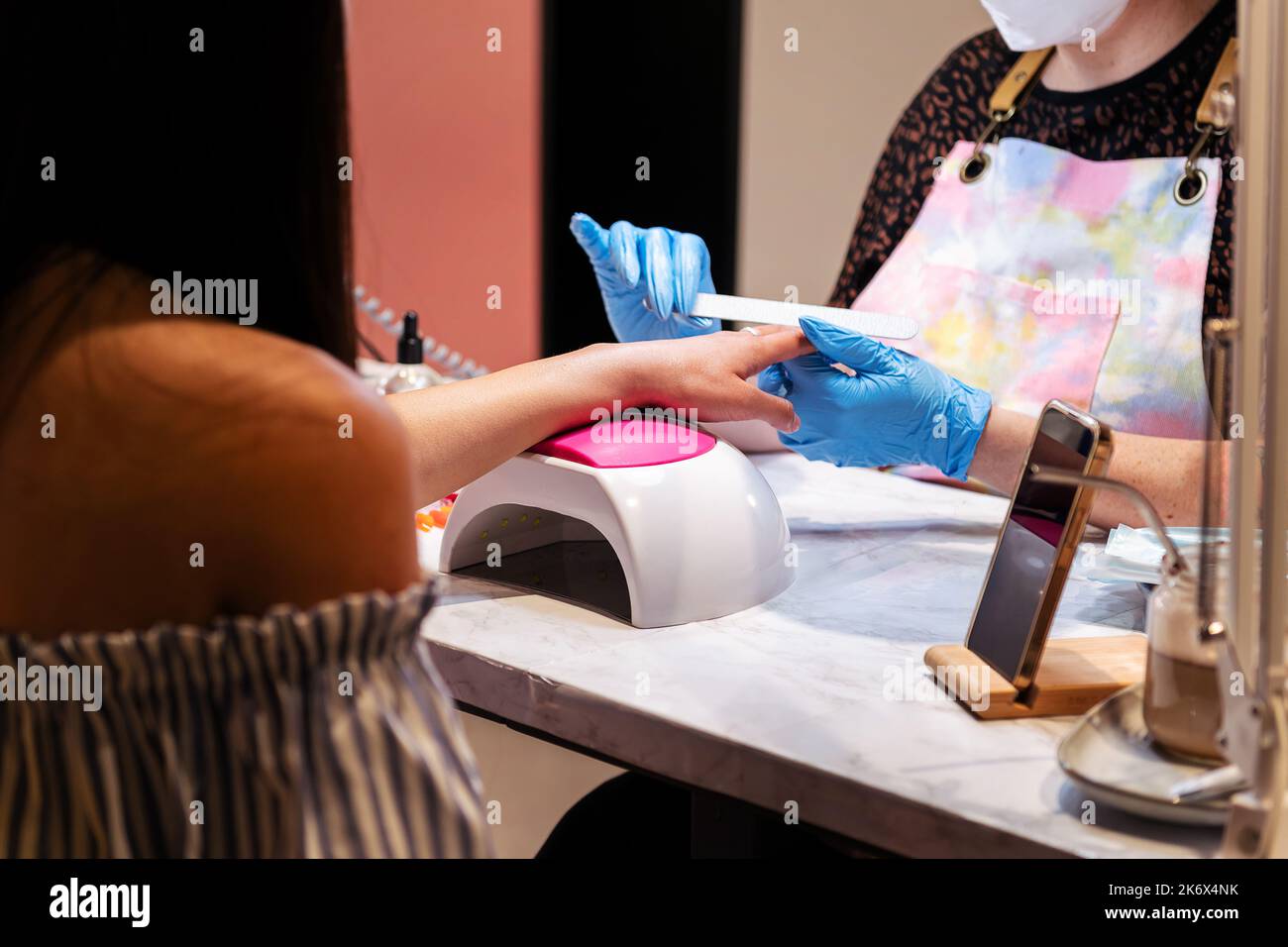 Female hands filing nails hi-res stock photography and images - Alamy