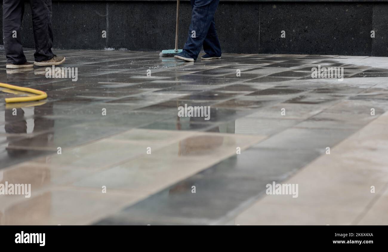 cleaning floor with self-cleaning flat mop. Cleaning concept Stock ...