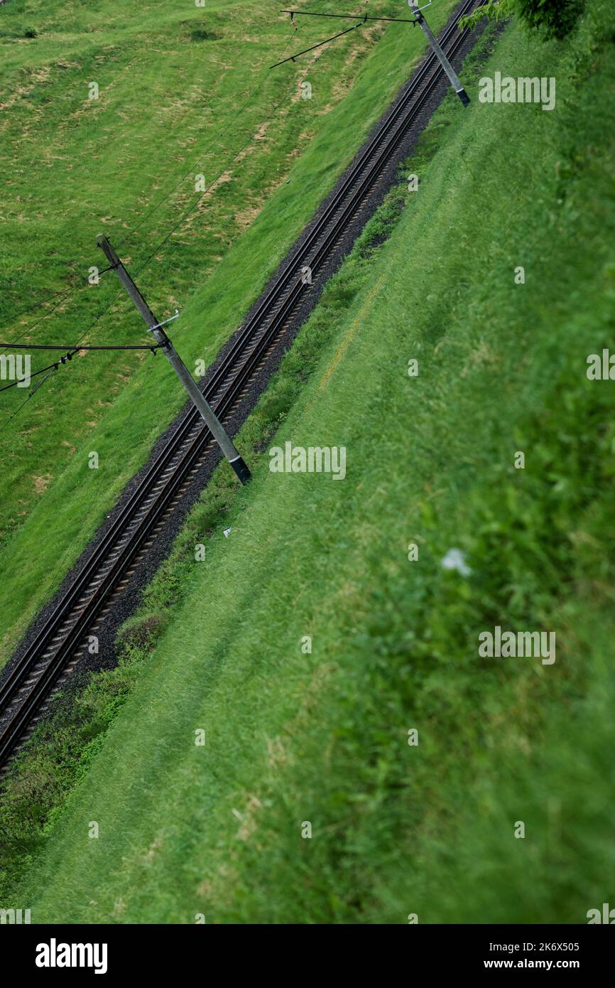 old trail track with green grass Stock Photo - Alamy