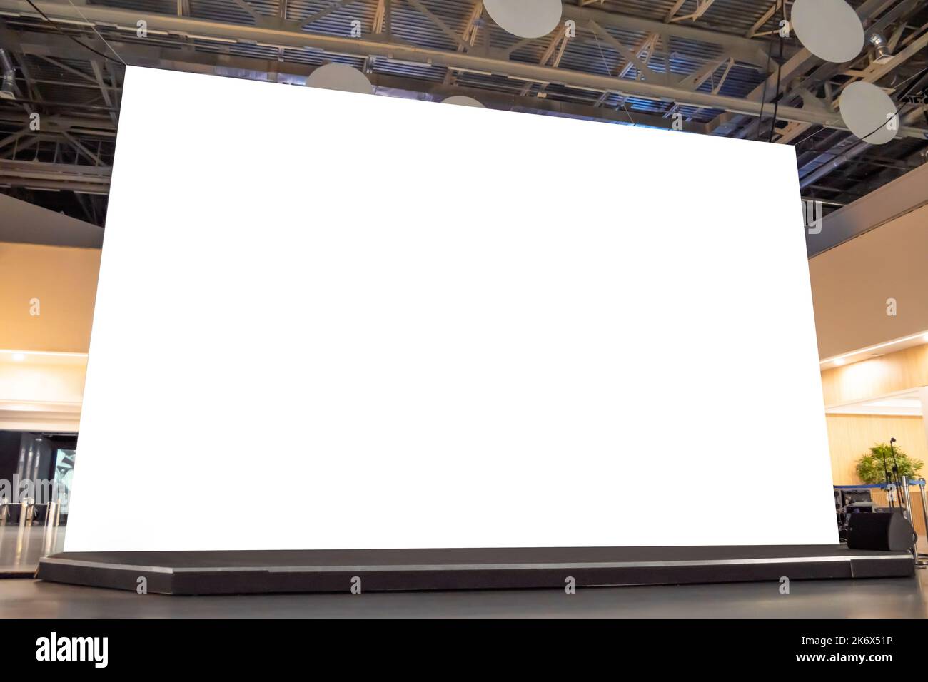 Woman looking at blank large interactive wall display - mock up concept ...