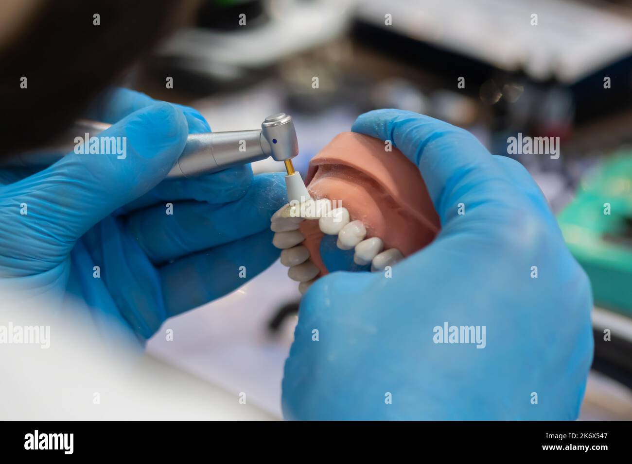 Dental technician working with dental prosthetics - close up view Stock ...