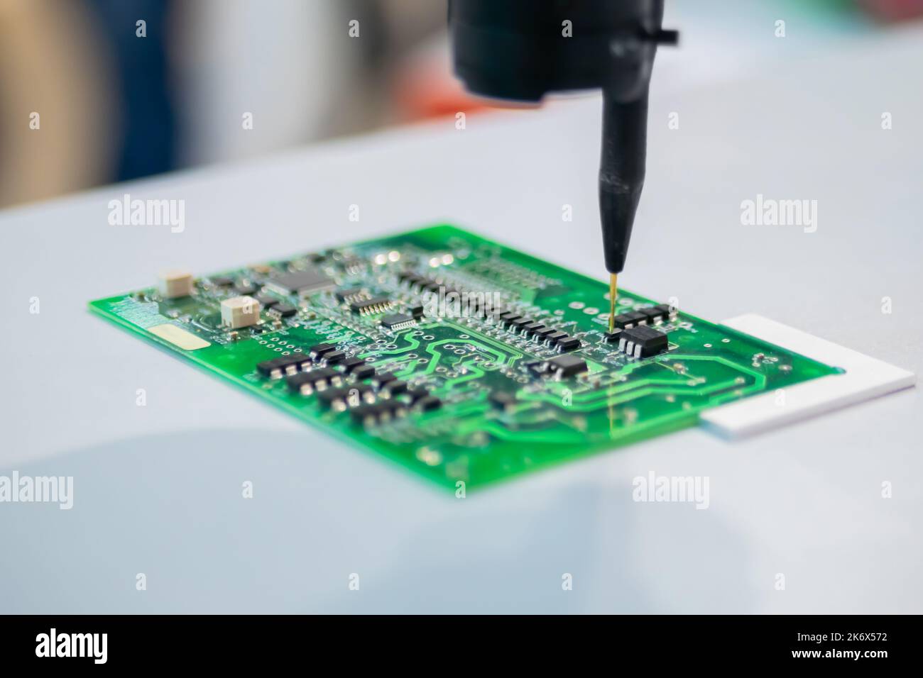 Automatic manipulator with dispenser needle during work with SMT pcb ...