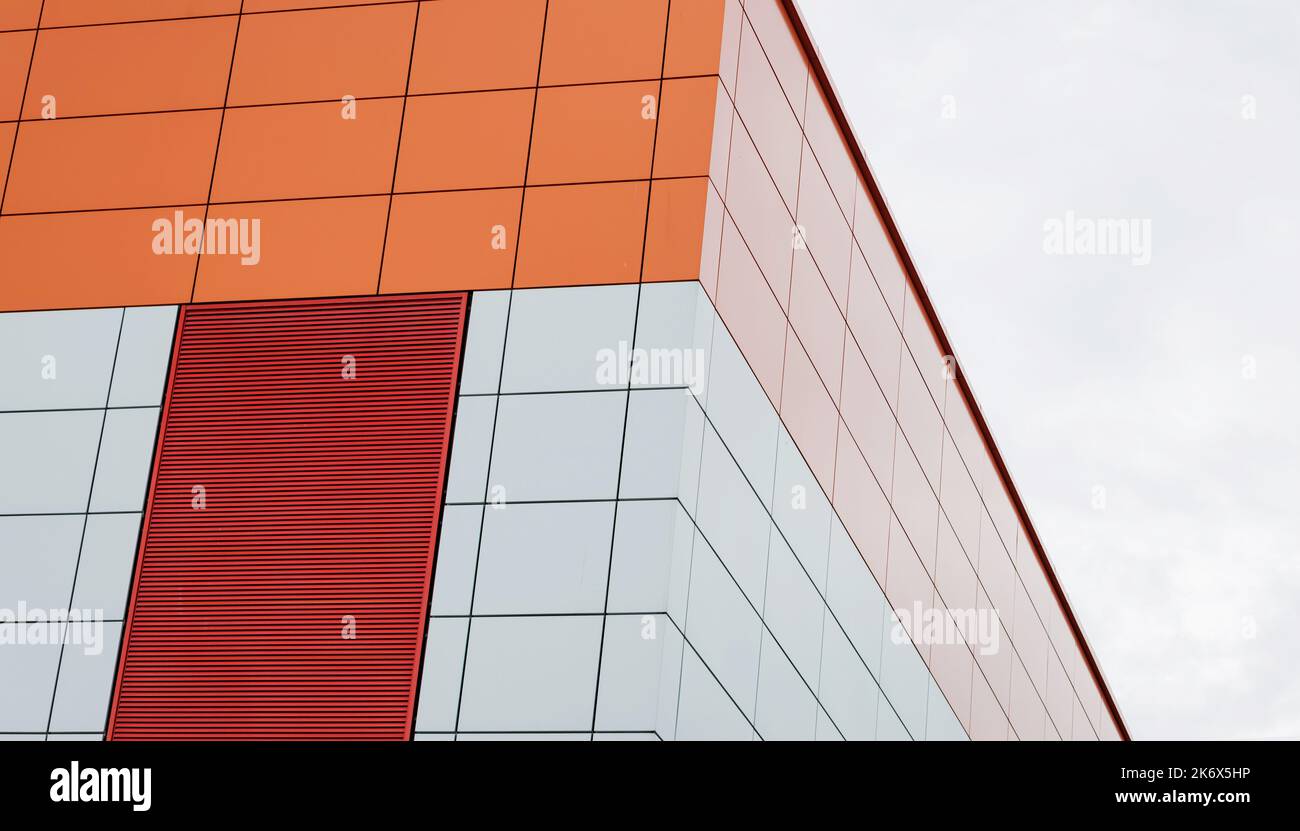 bright red steel facade of a warehouse. modern building Stock Photo - Alamy