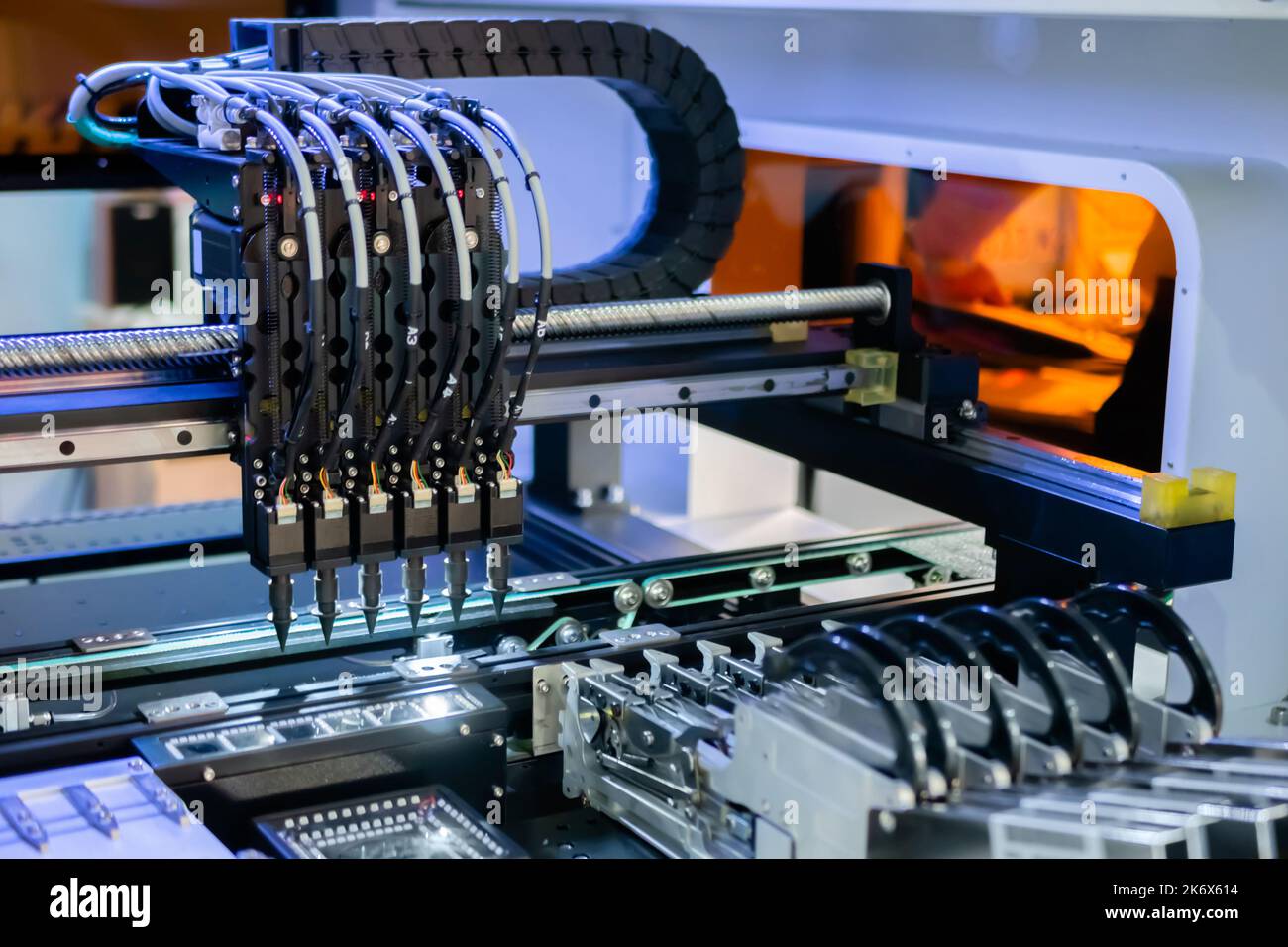 Automatic SMD pick and place machine assembling computer circuit board Stock Photo - Alamy