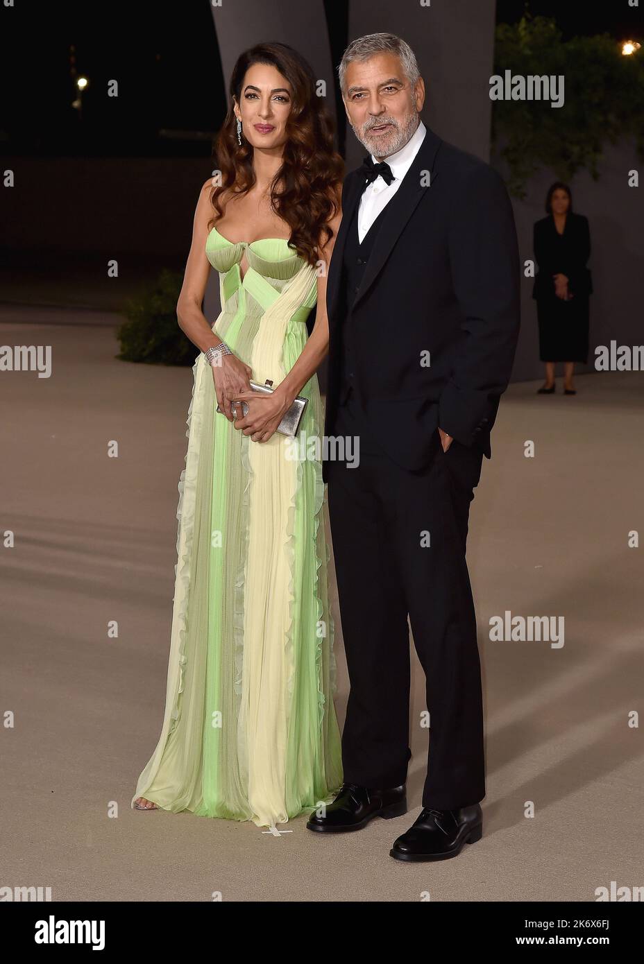 Amal Clooney and George Clooney walking the red carpet at the Second ...