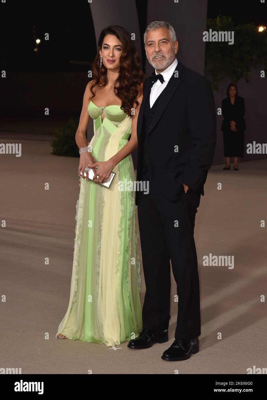 Amal Clooney and George Clooney walking the red carpet at the Second ...