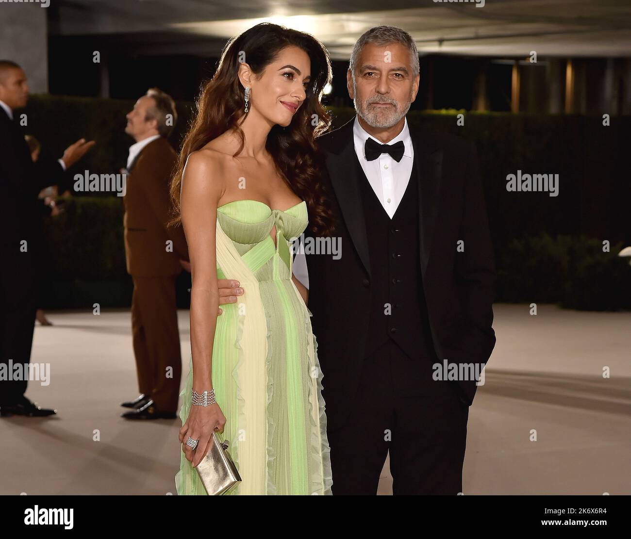 Amal Clooney and George Clooney walking the red carpet at the Second ...