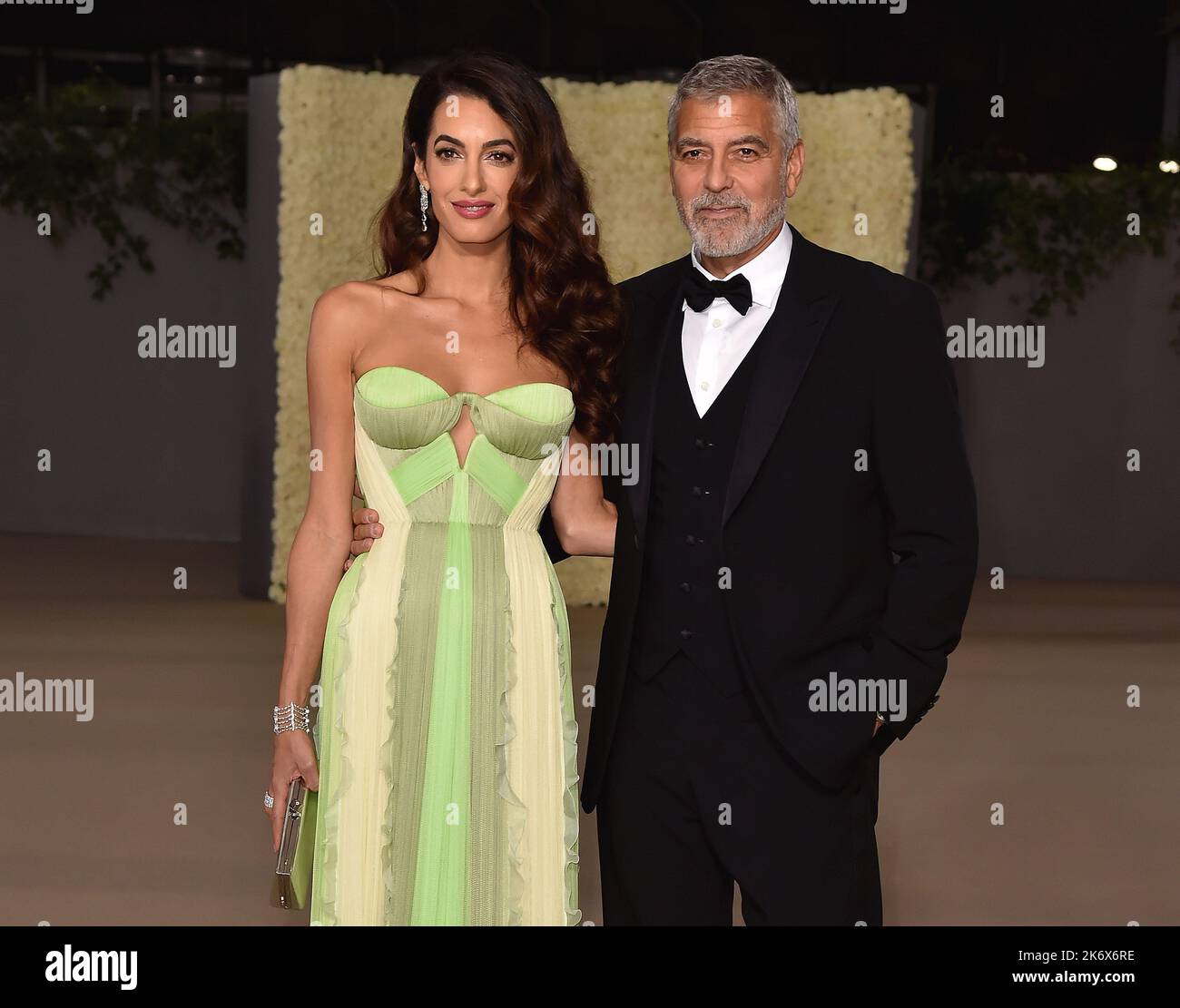 Amal Clooney and George Clooney walking the red carpet at the Second ...