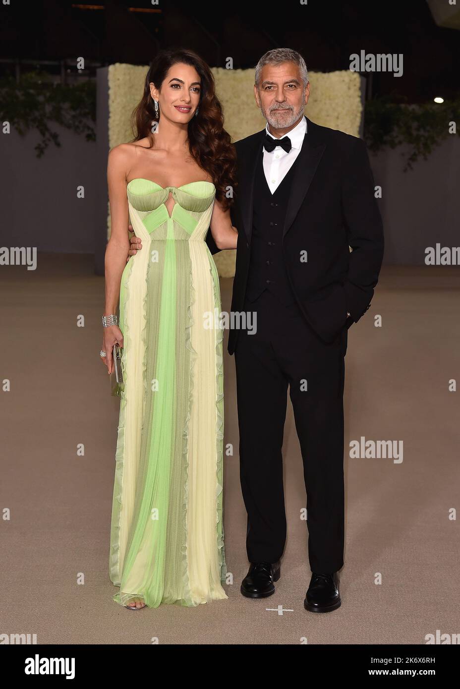 Amal Clooney and George Clooney walking the red carpet at the Second ...