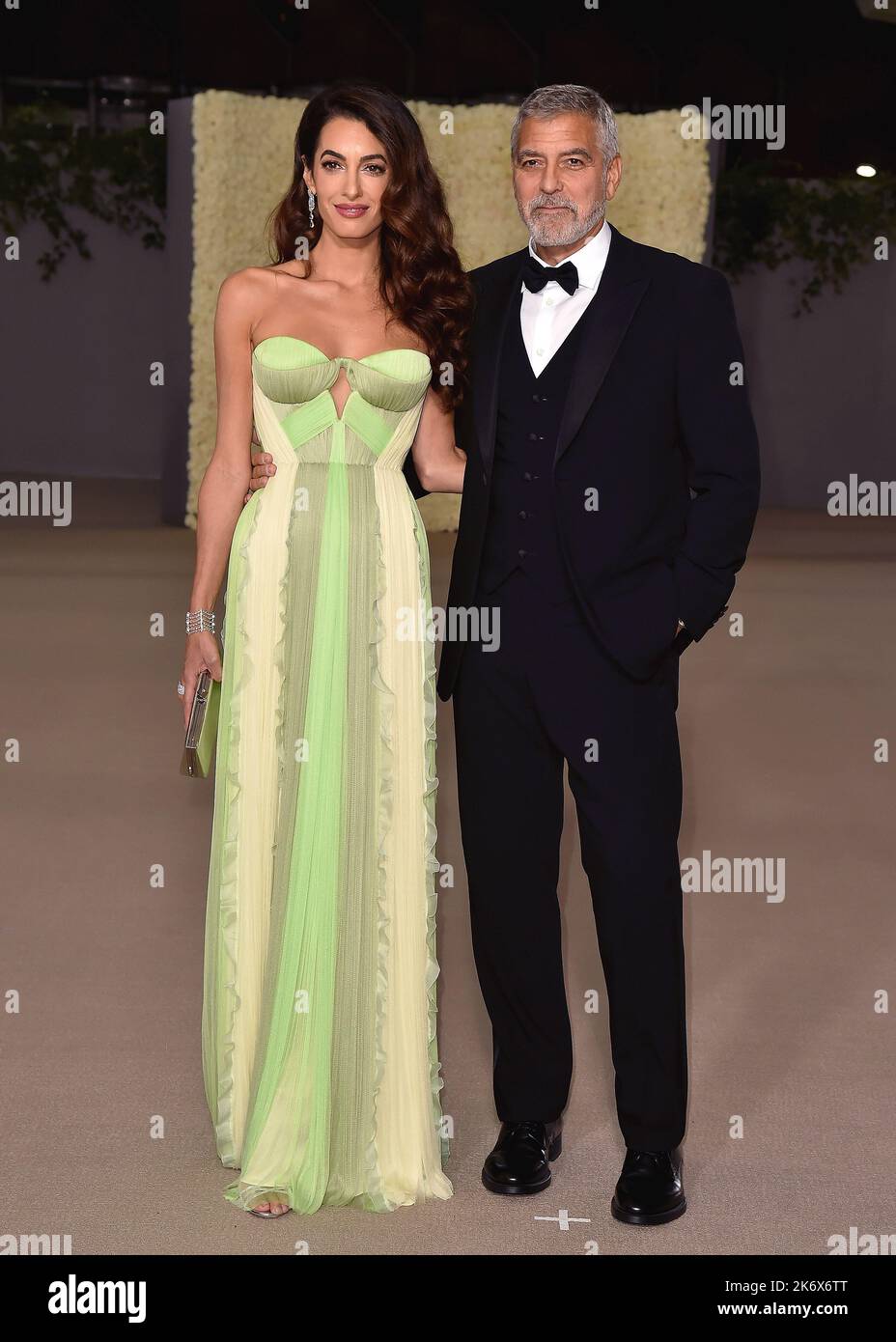 Amal Clooney and George Clooney walking the red carpet at the Second ...