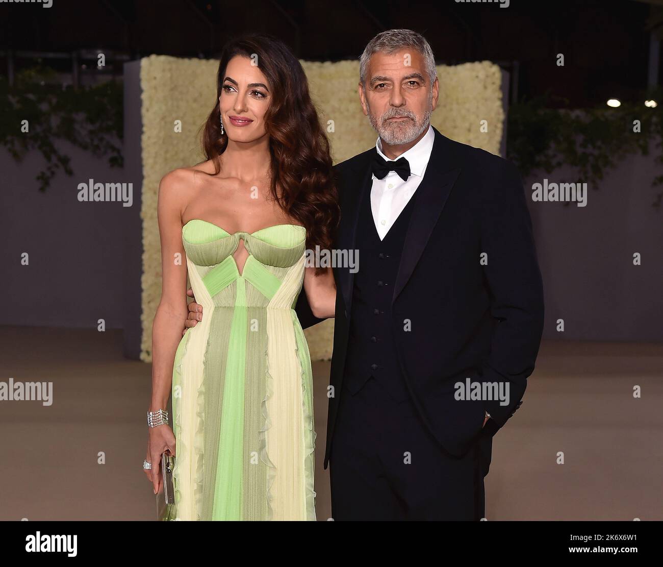 Amal Clooney and George Clooney walking the red carpet at the Second ...