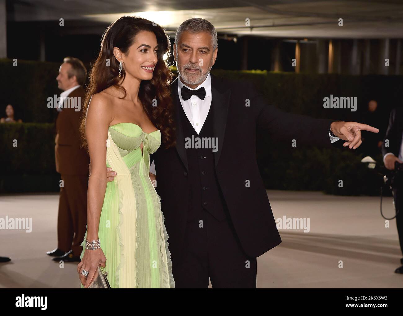 Amal Clooney and George Clooney walking the red carpet at the Second ...