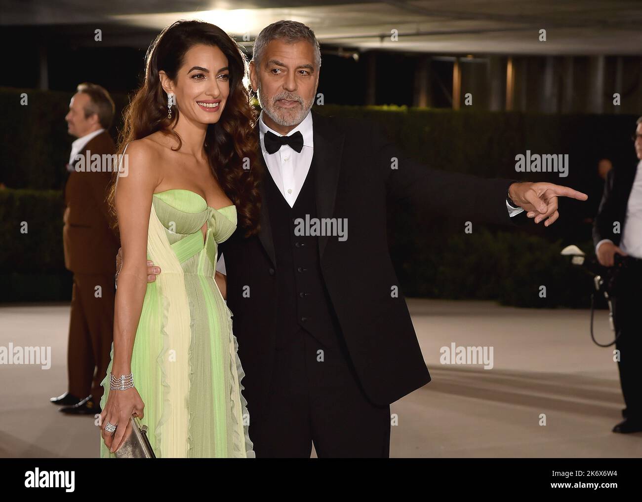 Amal Clooney and George Clooney walking the red carpet at the Second ...