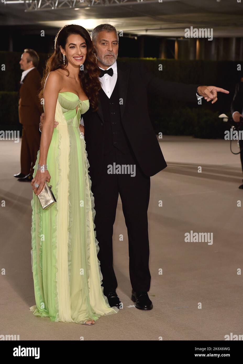 Amal Clooney and George Clooney walking the red carpet at the Second ...