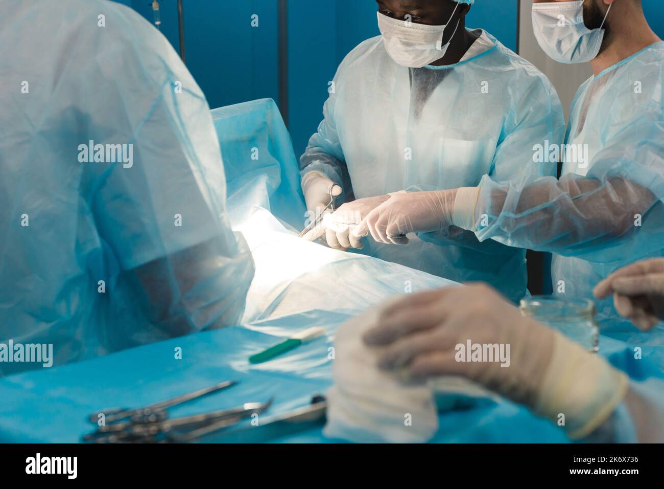 The senior surgeon in the operating room, where the patient is waiting ...