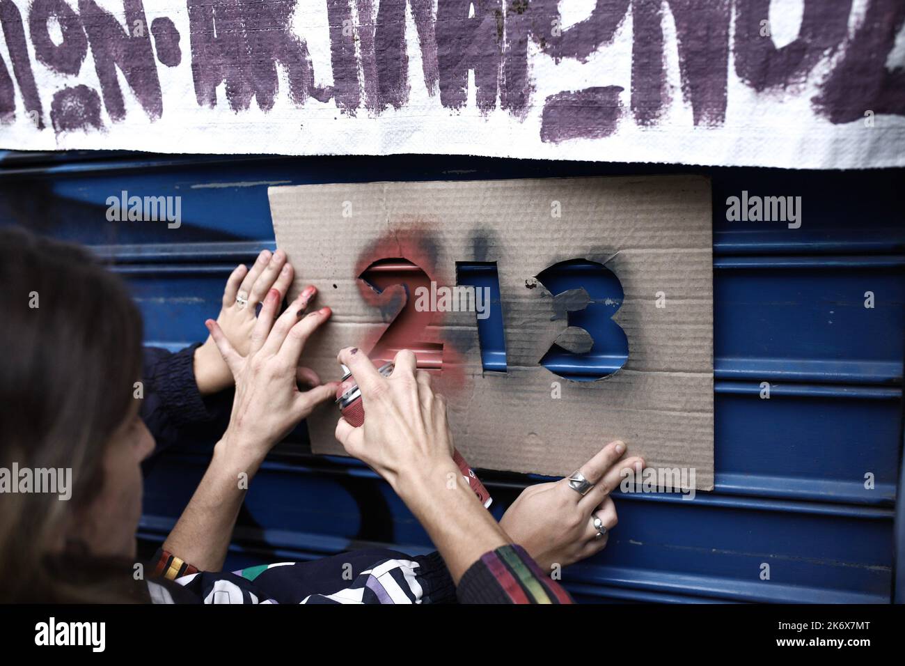 Athens, Greece. 15th Oct, 2022. Women spray paint on the number 213 ...