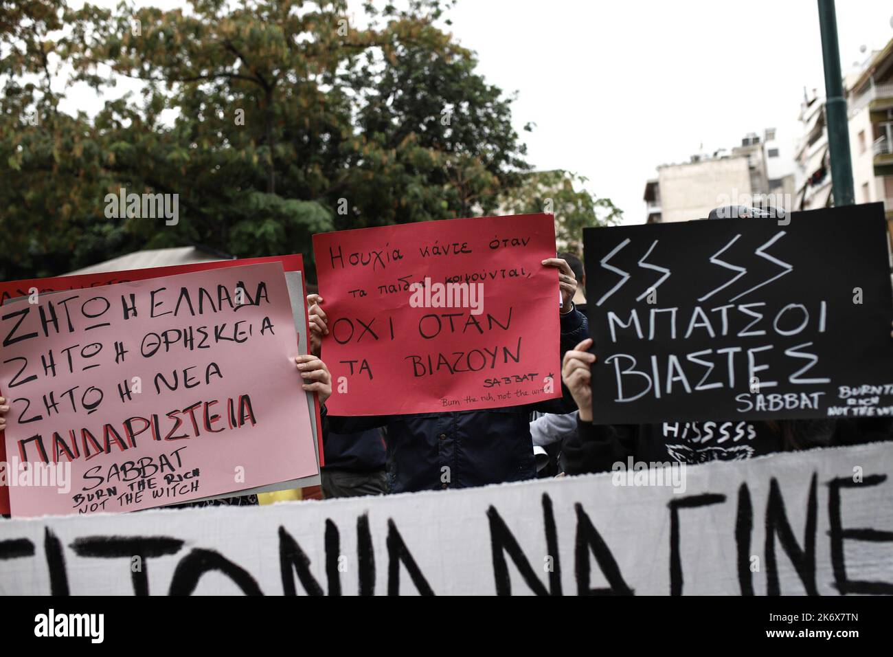 Athens, Greece. 15th Oct, 2022. Protesters hold a banner and placards ...